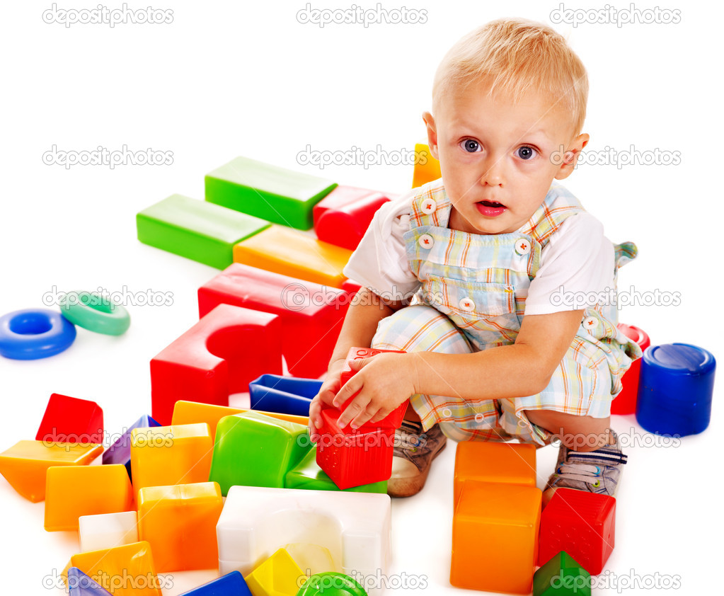 Children play building blocks. — Stock Photo © poznyakov #12100222 Children play building blocks. — Stock Photo © poznyakov #12100222