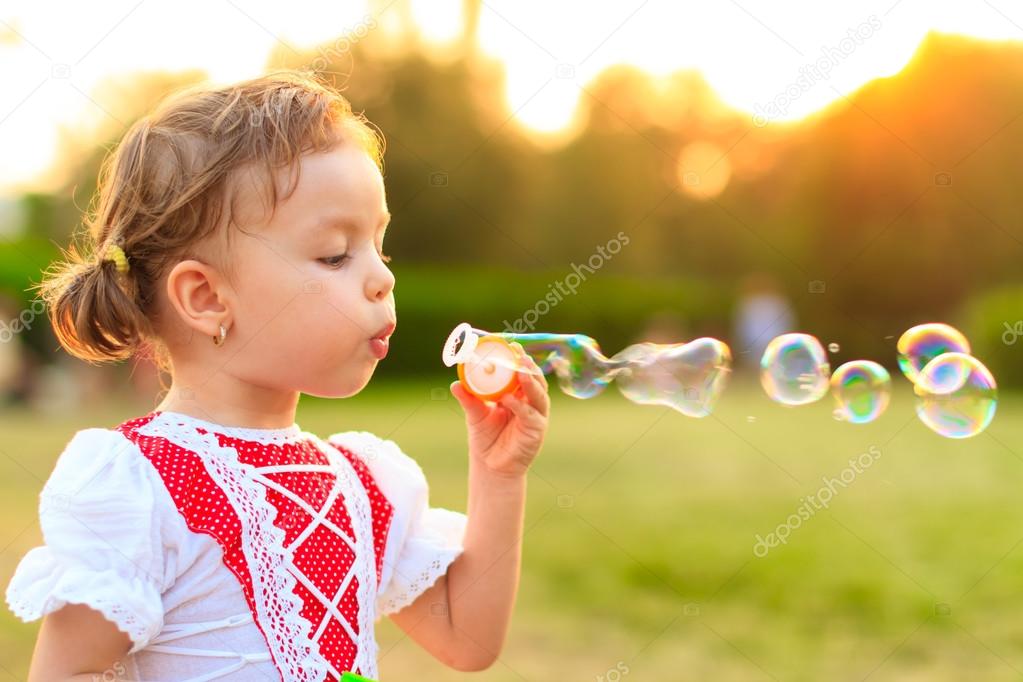 Child blowing soap bubbles. — Stock Photo © Studio37 #23513417 Child blowing soap bubbles. — Stock Photo © Studio37 #23513417