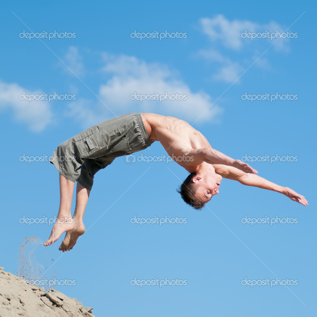 Excited young man jumping in air — Stock Photo © markin #19954447 Excited young man jumping in air — Stock Photo © markin #19954447