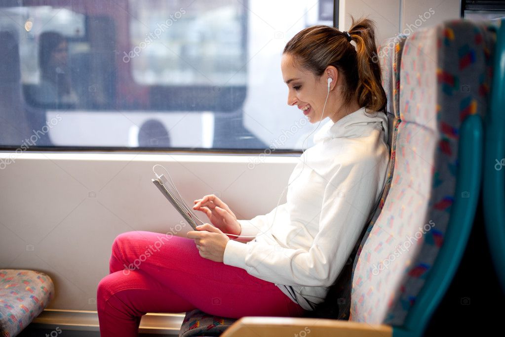 Young woman using tablet computer on the train — Stock Photo © mindof ... Young woman using tablet computer on the train — Stock Photo © mindof ...