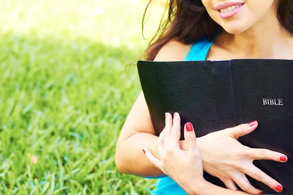 Woman Reading Bible In Park - Stock Image - Everypixel