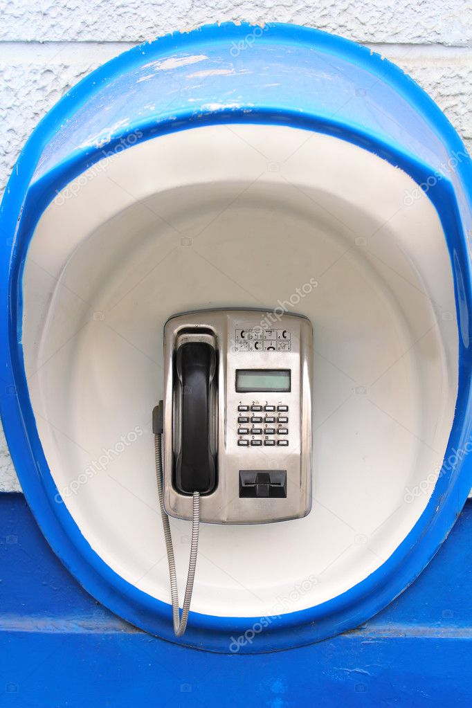 Blue pay-phone on wall — Stock Photo © boroda #48563349