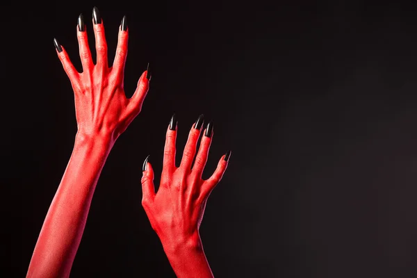 Red devil hands with sharp black nails, real body-art — Stock Photo ...