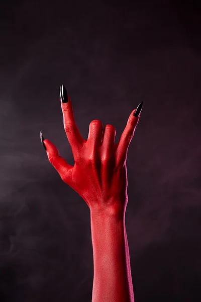 Heavy metal, red devil hand with black nails Stock Photo by ©Elisanth ...