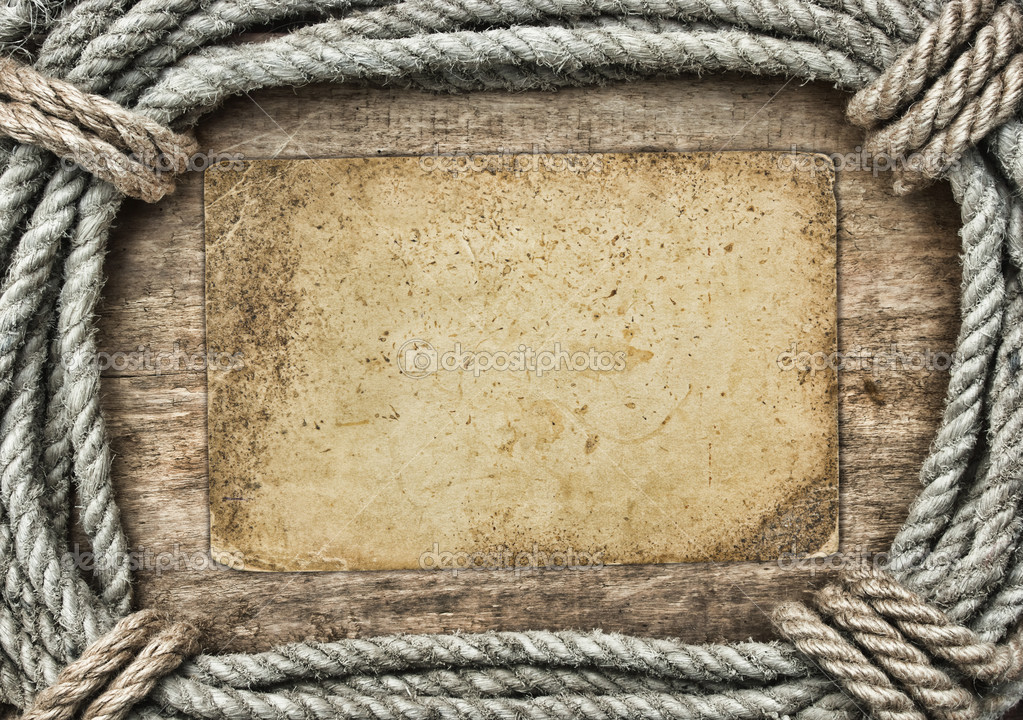 Frame made of twisted rope and old paper on a wooden background ⬇ Stock ...