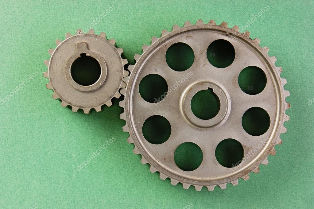 Two gears on a green background Stock Photo by ©Observer 25721795