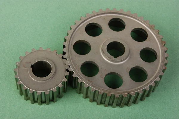 Two gears on a green background Stock Photo by ©Observer 25721795