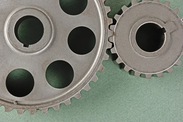 Two gears on a green background Stock Photo by ©Observer 25721795