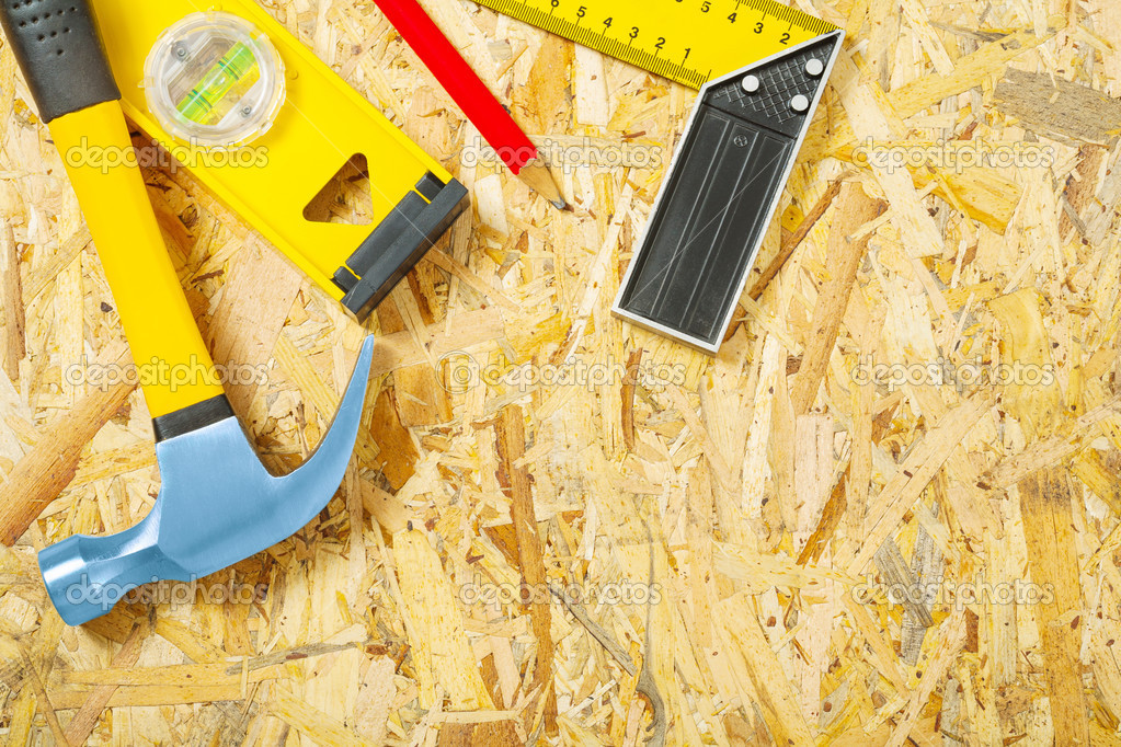 Construction tools on plywood Stock Photo by ©mihalec 23071070