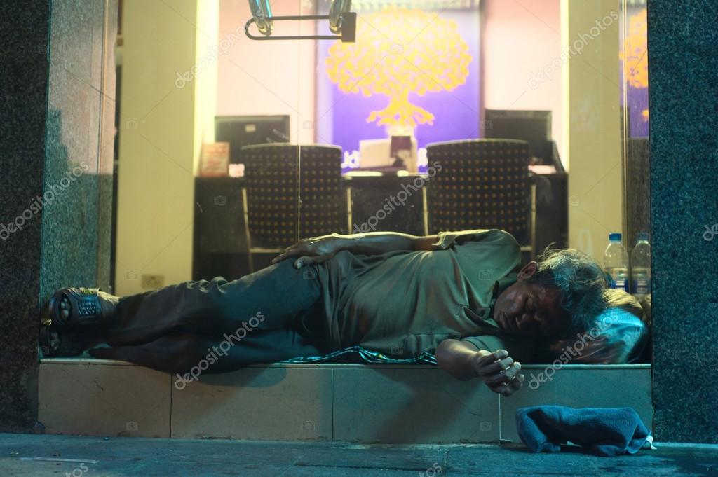 Homeless sleeping in the street – Stock Editorial Photo © joyfull #44614849