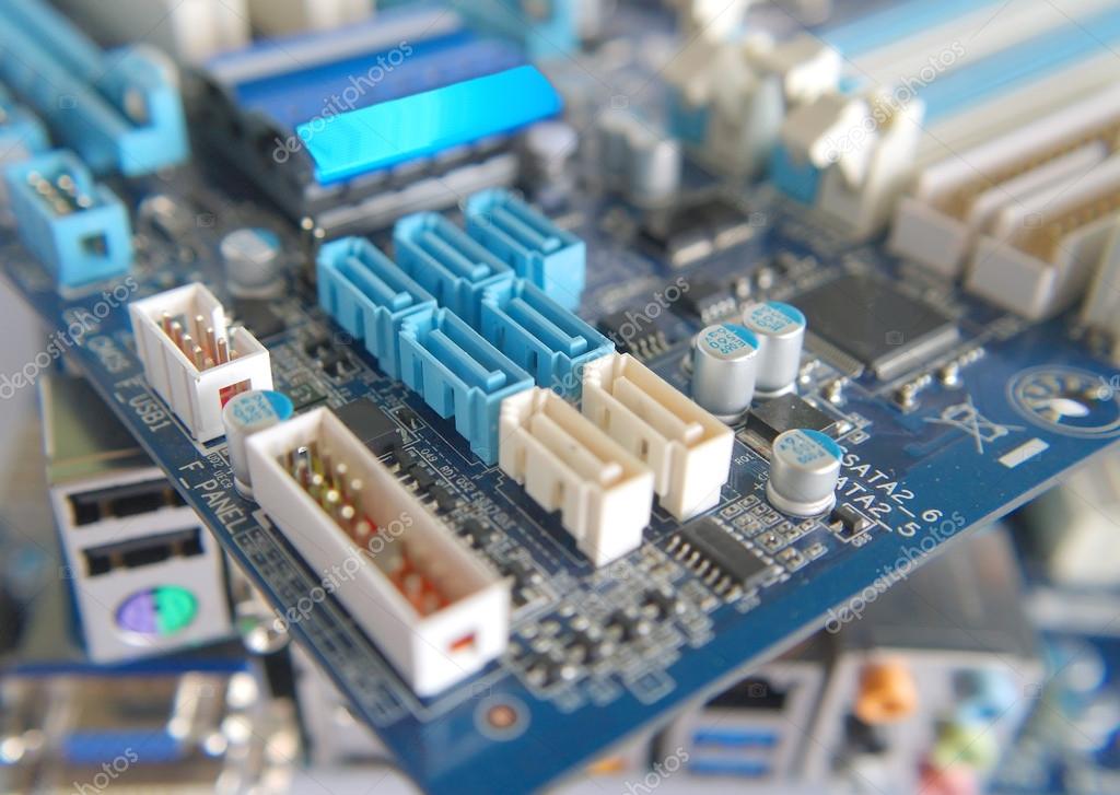 Fragment of computer main board Stock Photo by ©sergpetd 21891911