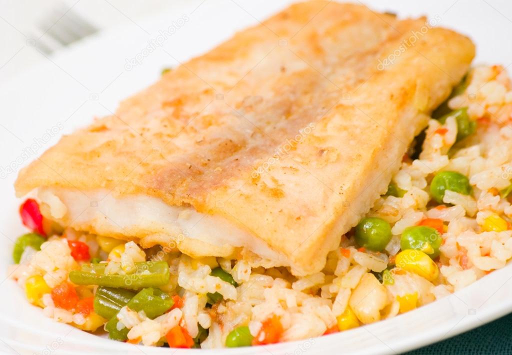 Fish fillet with rice and vegetables Stock Photo by ©semenovp 19701767