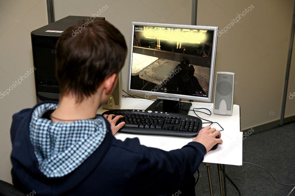 Young man playing computer game — Stock Photo © konstantin32 #31000645 Young man playing computer game — Stock Photo © konstantin32 #31000645
