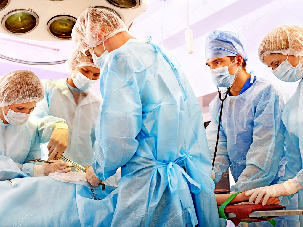 Surgeon at work in operating room. Stock Photo by ©poznyakov 12070892