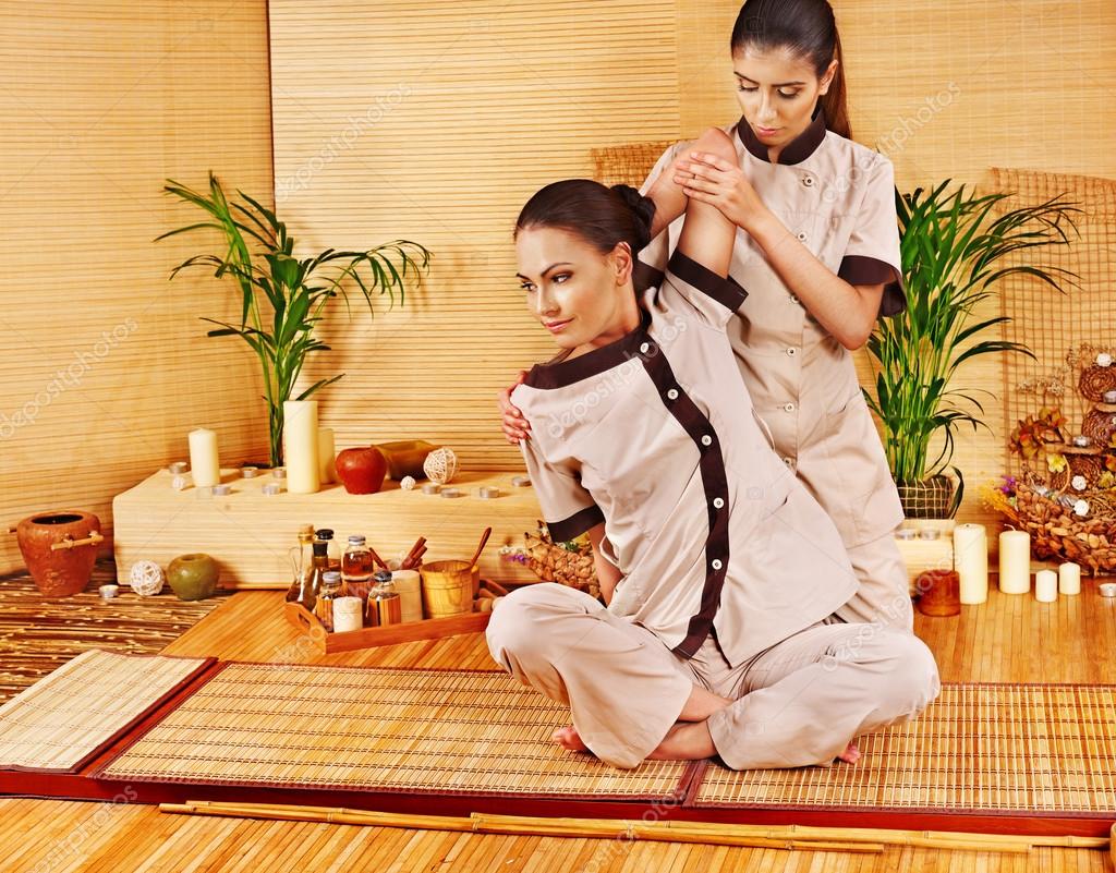 Therapist giving stretching massage to woman. — Stock Photo © poznyakov ...