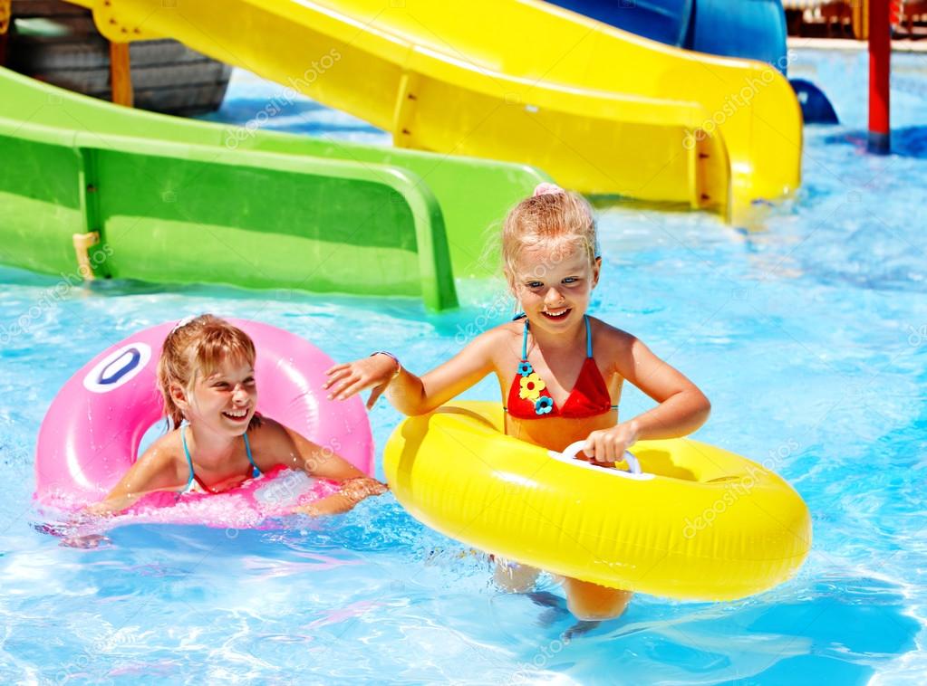 Children sitting on inflatable ring. Stock Photo by ©poznyakov 23311330