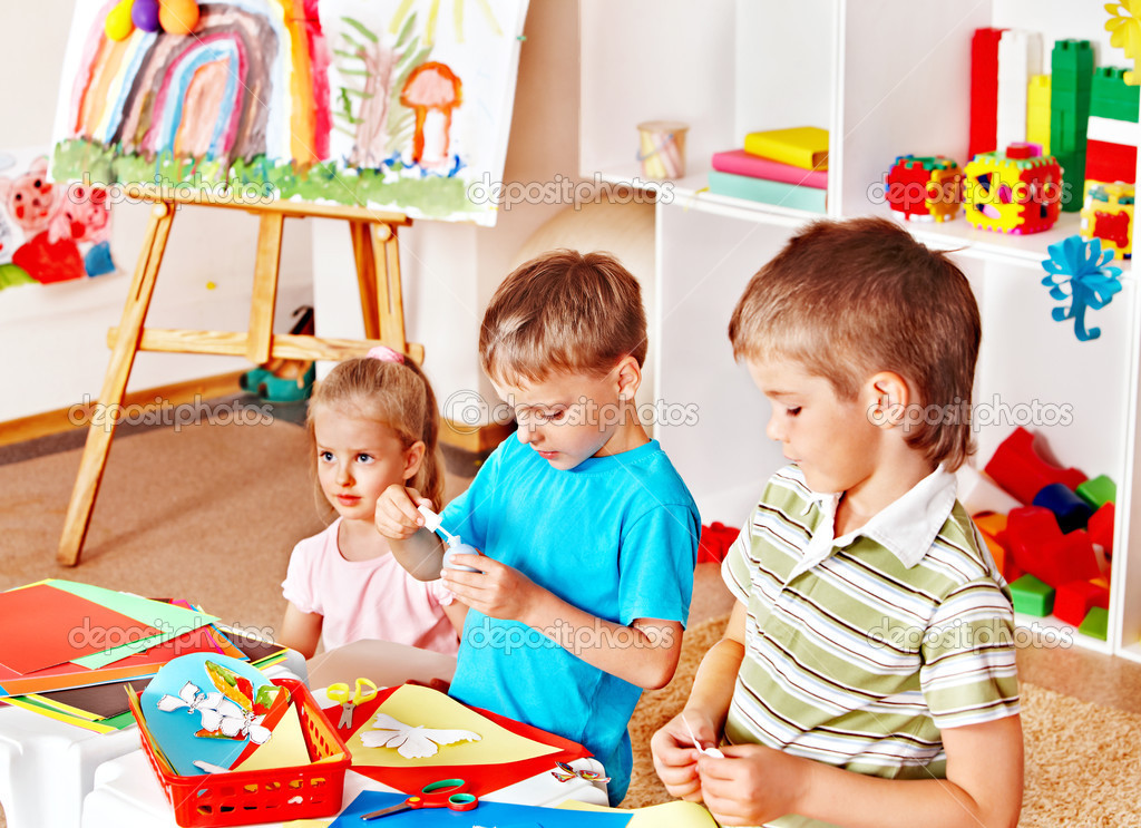 Child cutting out scissors paper. — Stock Photo © poznyakov #24050903