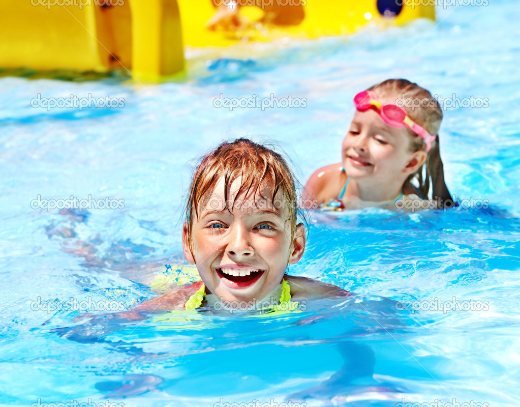 Children on water slide at aquapark. — Stock Photo © poznyakov #26316007