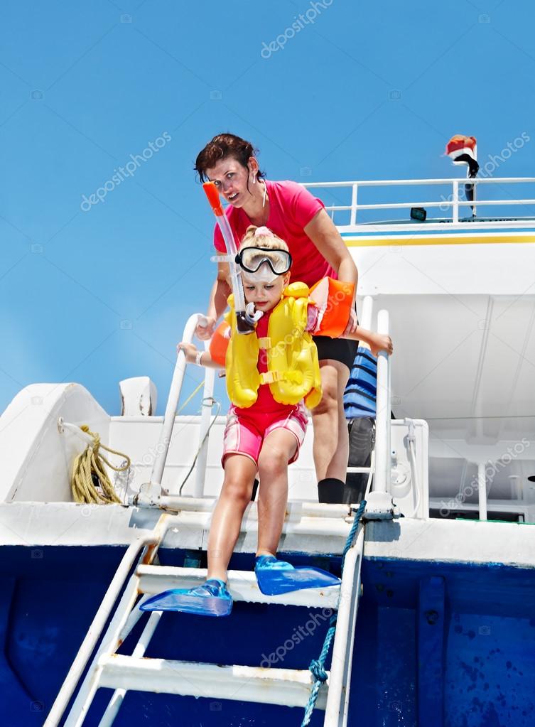Happy family with child on yacht. — Stock Photo © poznyakov #29031173