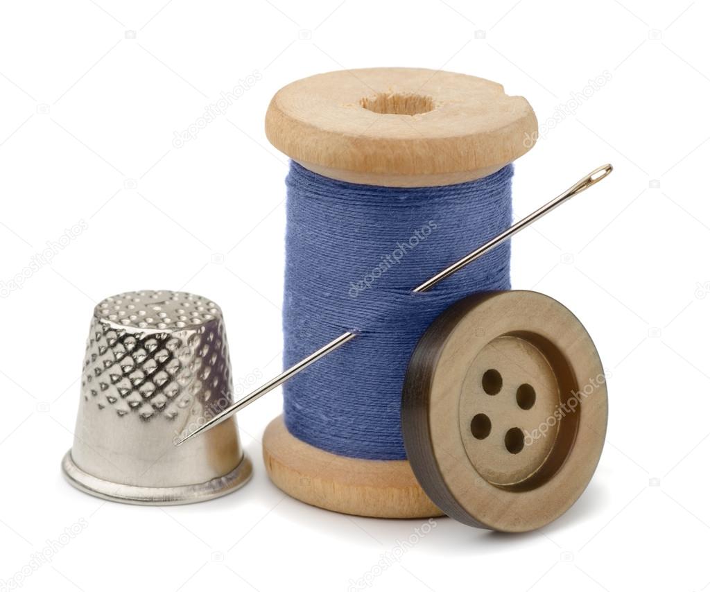 Thread, needle and thimble Stock Photo by ©coprid 35169255