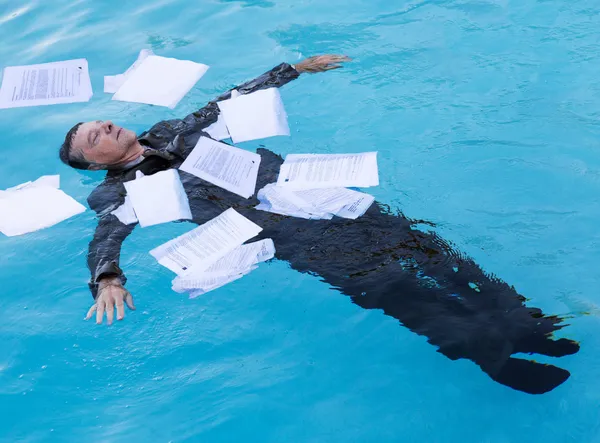 Drowning in paper Stock Photos, Royalty Free Drowning in paper Images ...
