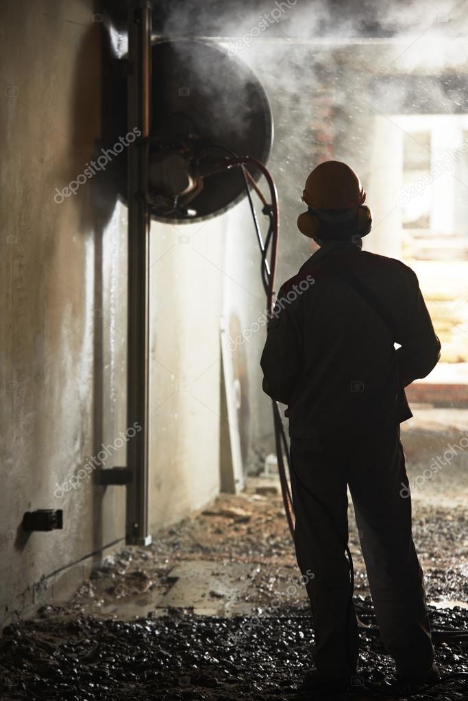 Builder worker operating demolition machine — Stock Photo © kalinovsky ...