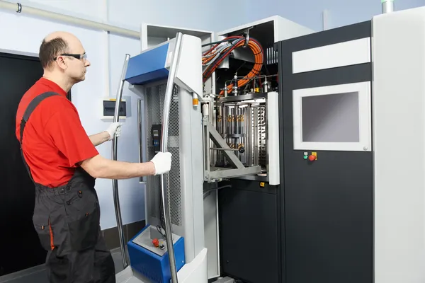 Industrial worker and coating equipment - Stock Image - Everypixel