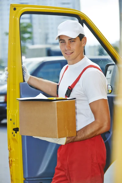 Delivery man with parcel box Stock Photo by ©kalinovsky 30415293