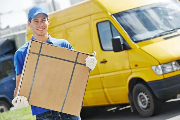 Delivery man with parcel box Stock Photo by ©kalinovsky 30415293