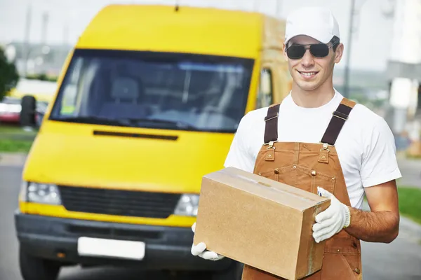 Delivery man with parcel box Stock Photo by ©kalinovsky 30415293
