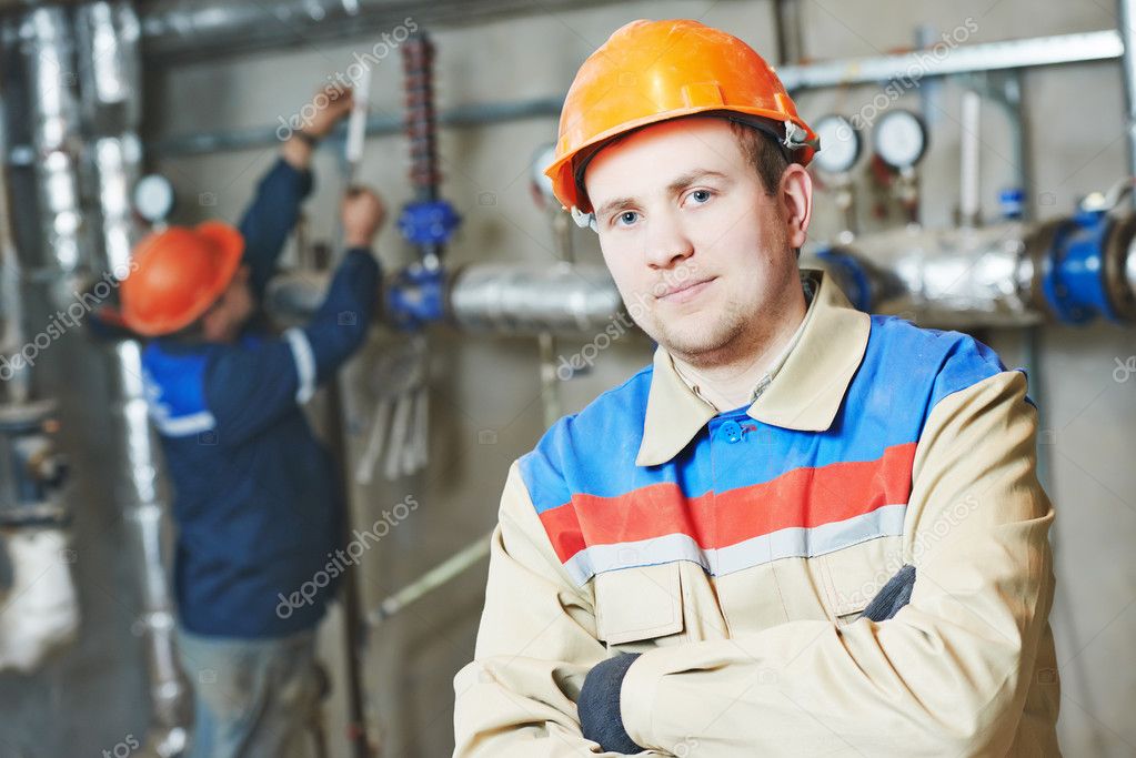 Heating engineer repairman in boiler room Stock Photo by ©kalinovsky ...