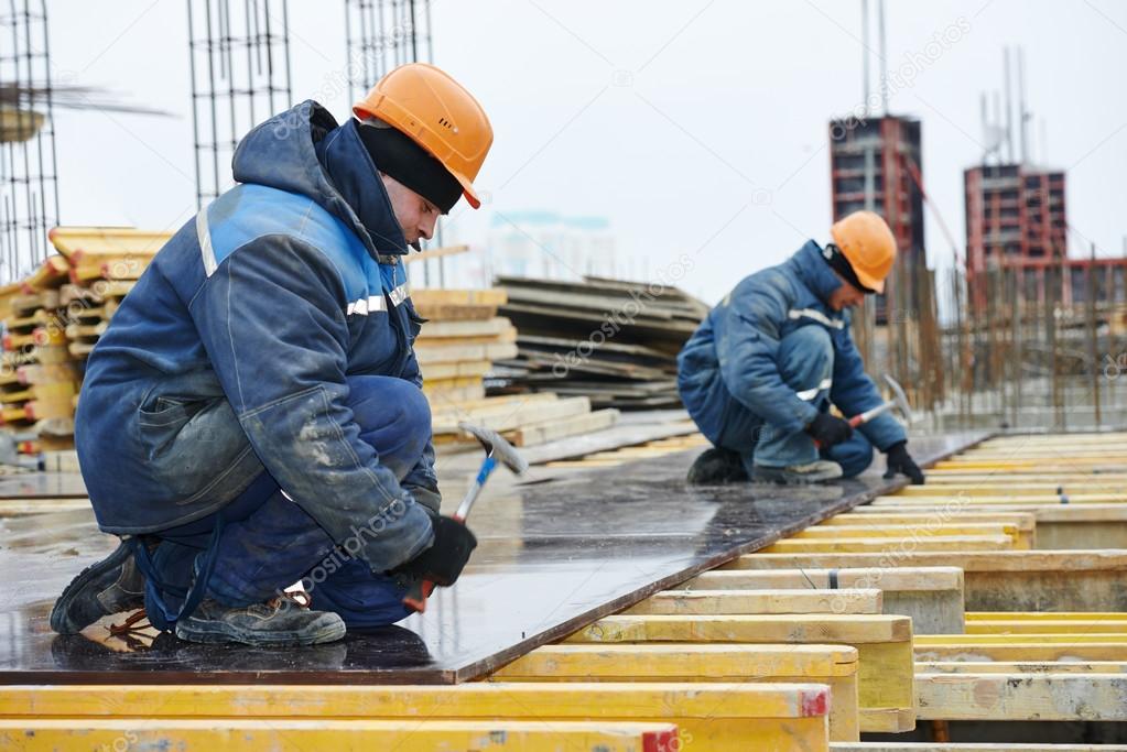 Construction worker preparing formwork Stock Photo by ©kalinovsky 41162693