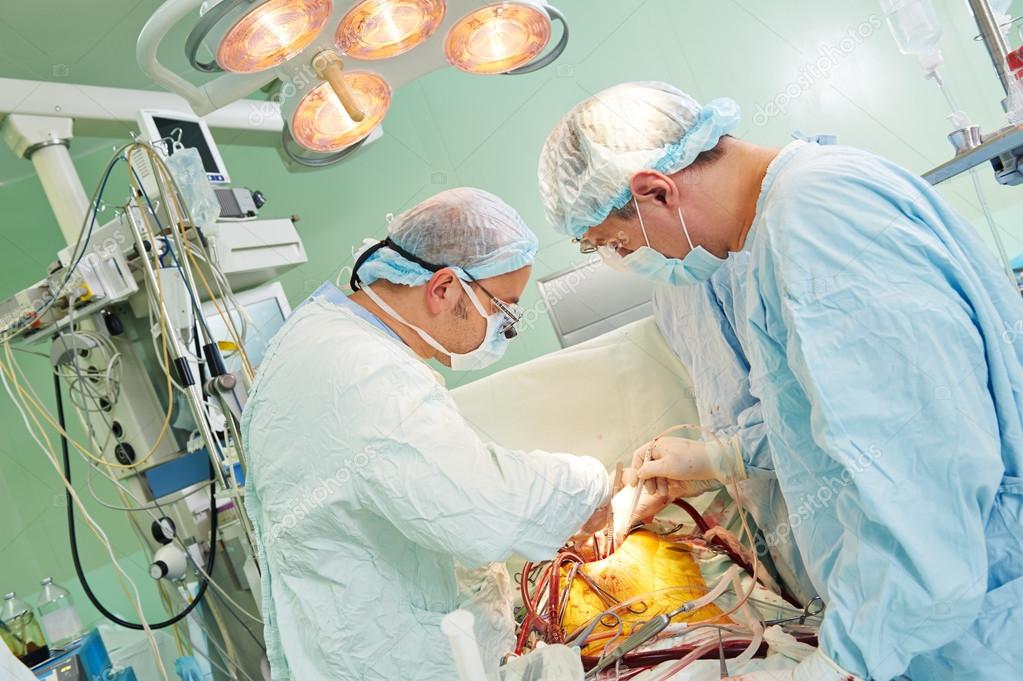 Surgeons team at cardiac surgery operation — Stock Photo © kalinovsky ...