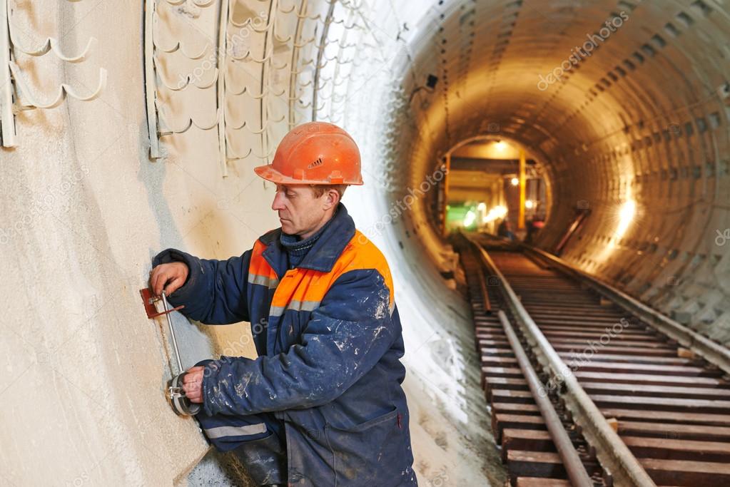 Tunnel worker at underground construction site Stock Photo by ...