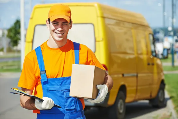 Delivery man with parcel box Stock Photo by ©kalinovsky 30415293