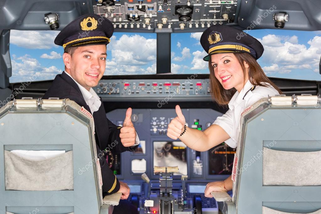 Happy Pilots in the Cockpit with Thumbs Up — Stock Photo © william87 ...