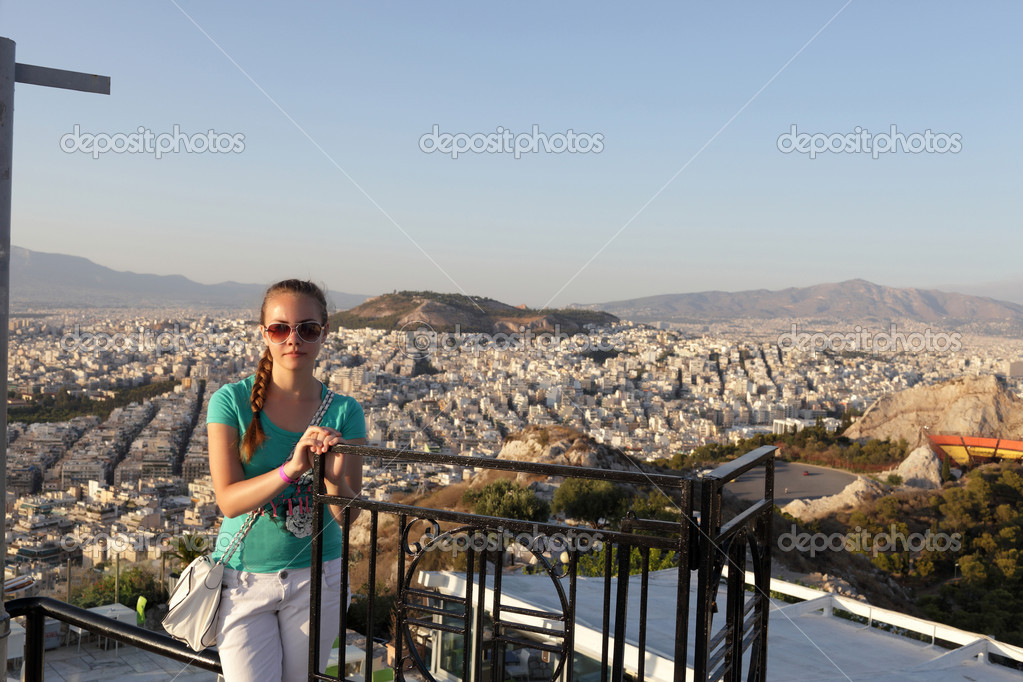 Girl posing on Athens background Stock Photo by ©AChubykin 16470447