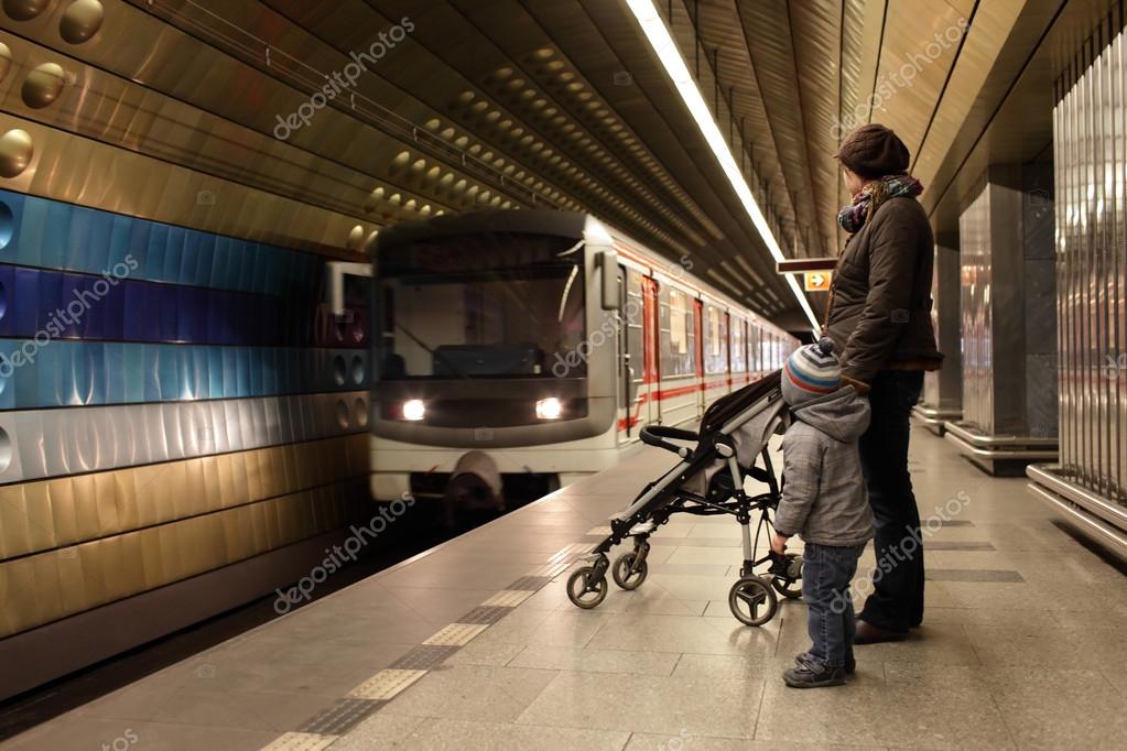 Mother with son at subway station Stock Photo by ©AChubykin 45933441