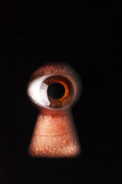 Eye looking through a keyhole Stock Photo by ©Shebeko 25183795