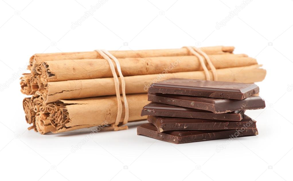 Broken chocolate bar and spices Stock Photo by ©spaxiax 48223293