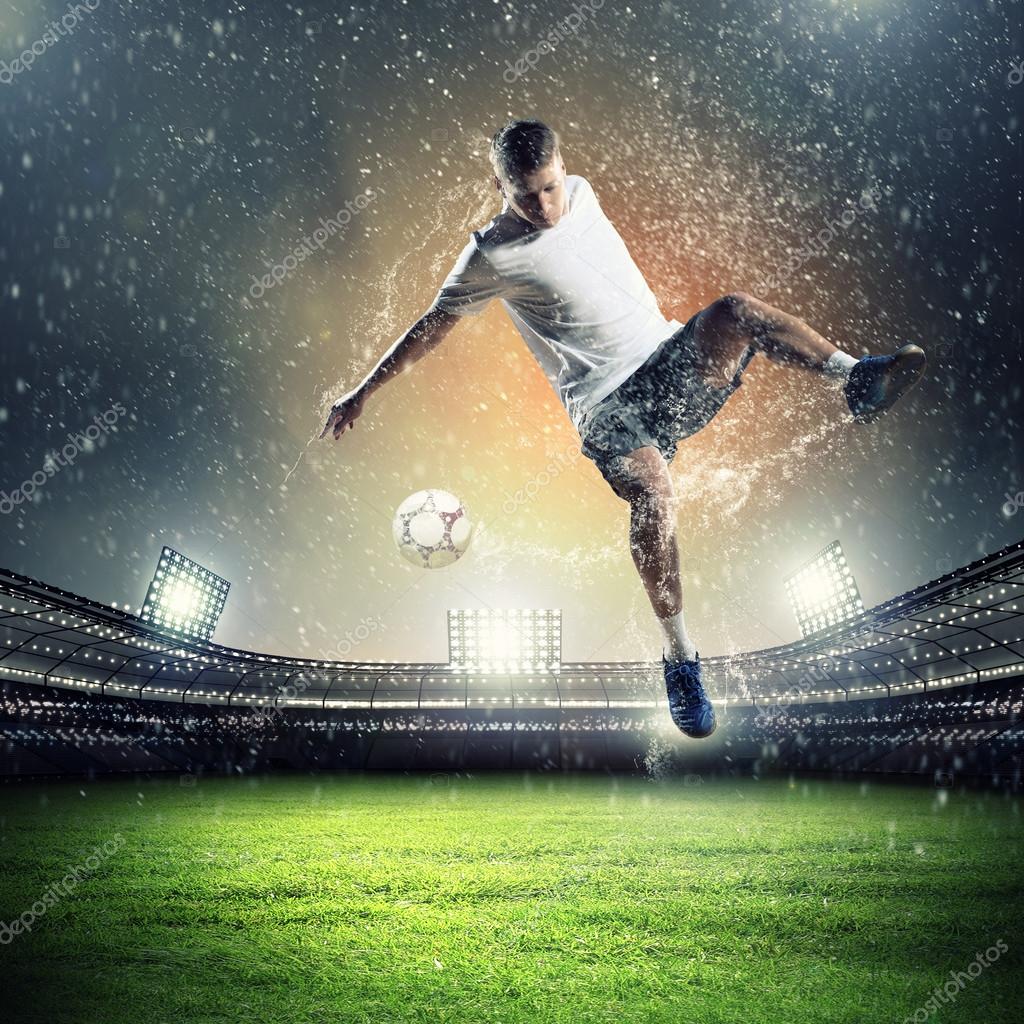 Football player striking the ball Stock Photo by ©SergeyNivens 21114929