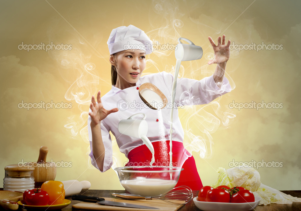 Asian female cooking with magic Stock Photo by ©SergeyNivens 21136953