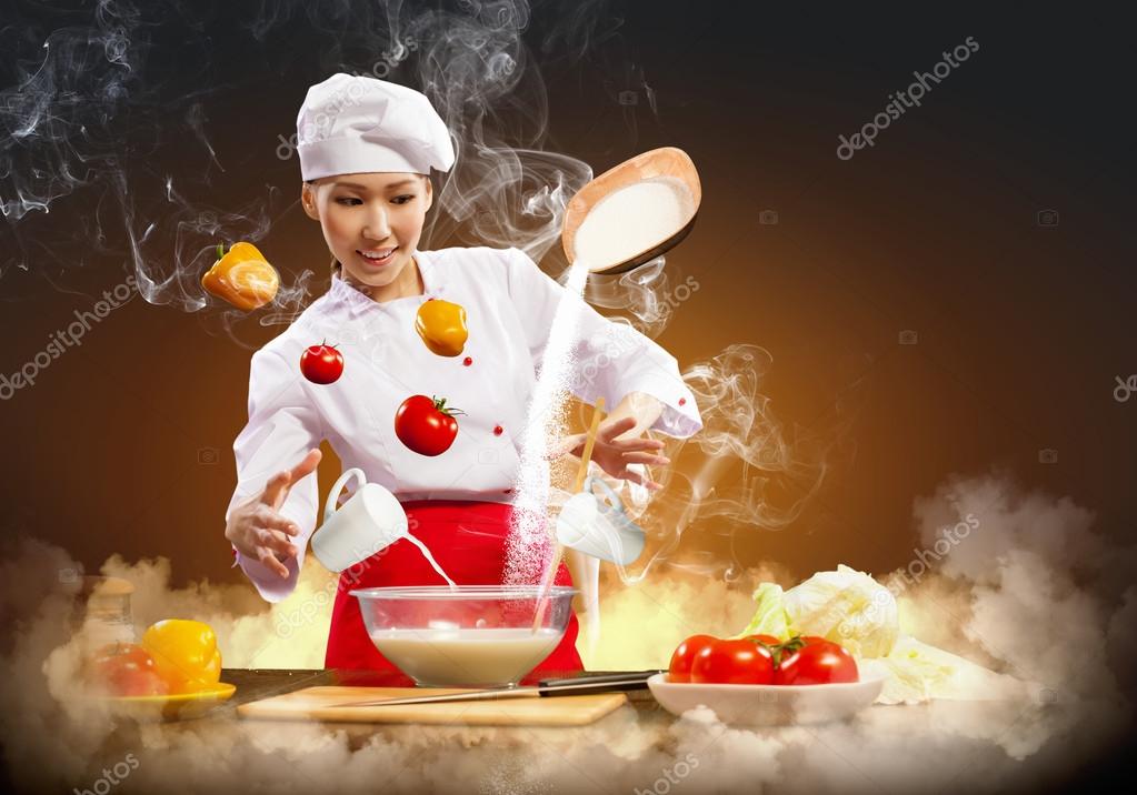 Asian female cooking with magic — Stock Photo © SergeyNivens #21137389