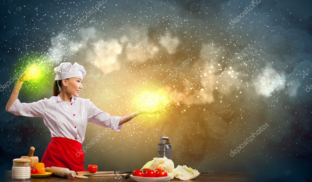 Asian female cooking with magic — Stock Photo © SergeyNivens #21137941