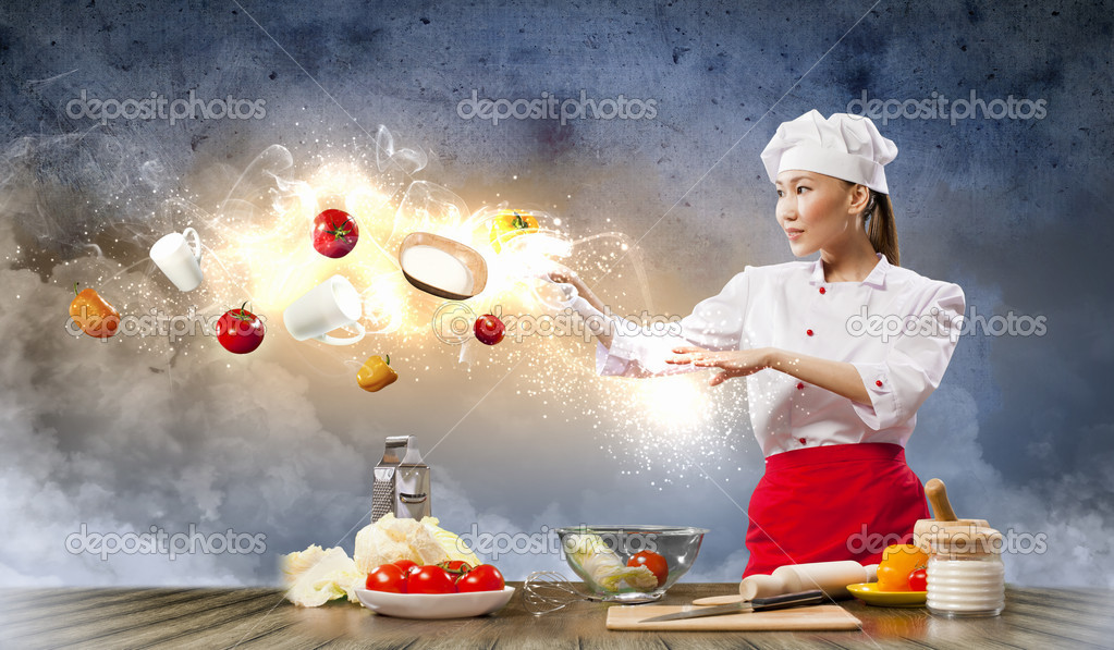Asian female cooking with magic Stock Photo by ©SergeyNivens 21137983