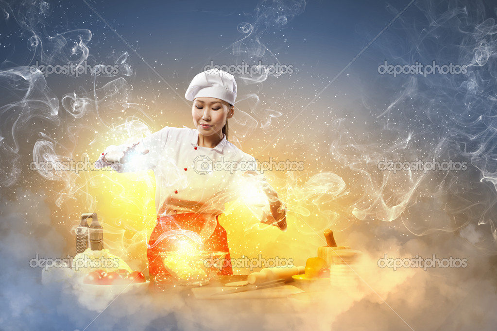 Asian female cooking with magic Stock Photo by ©SergeyNivens 21137999