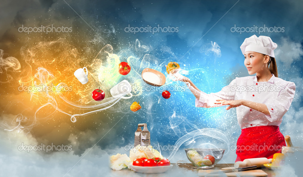 Asian female cooking with magic — Stock Photo © SergeyNivens #21138173