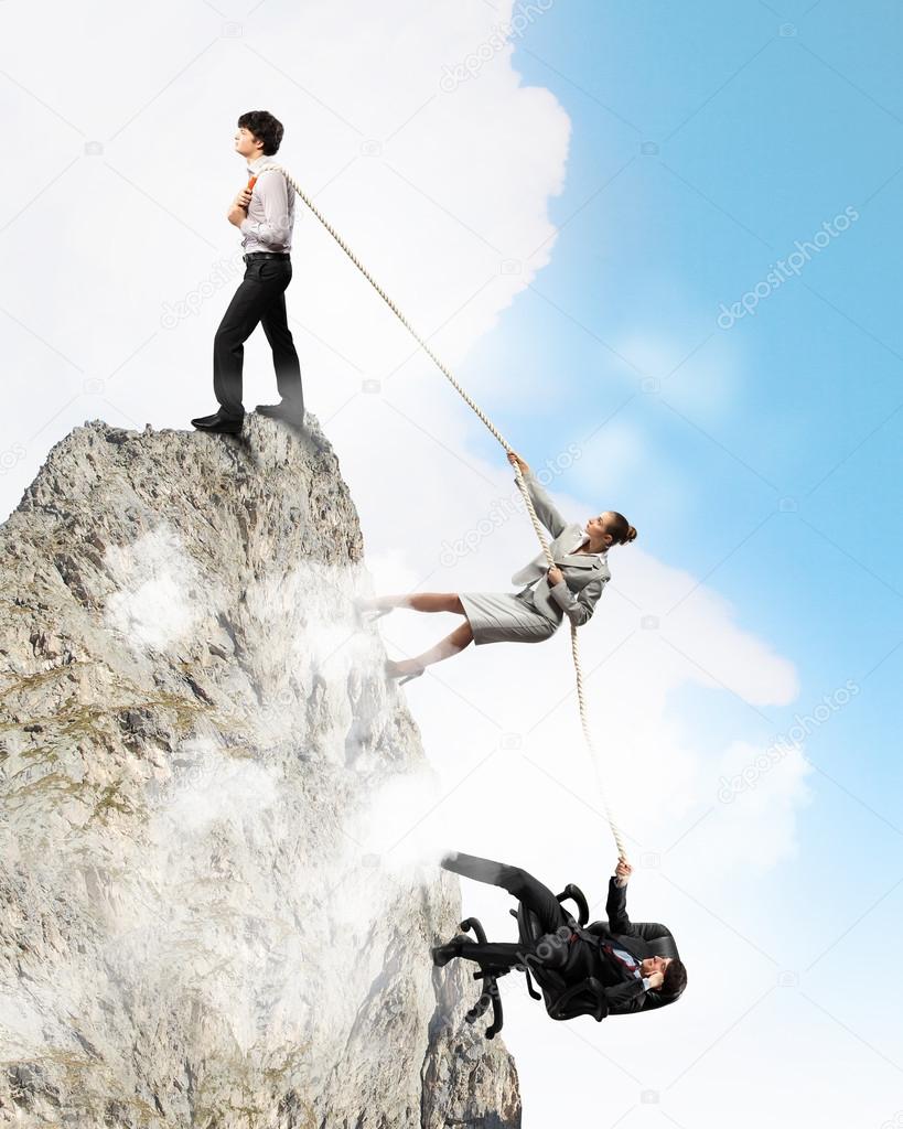 Three business pulling rope Stock Photo by ©SergeyNivens 21247911