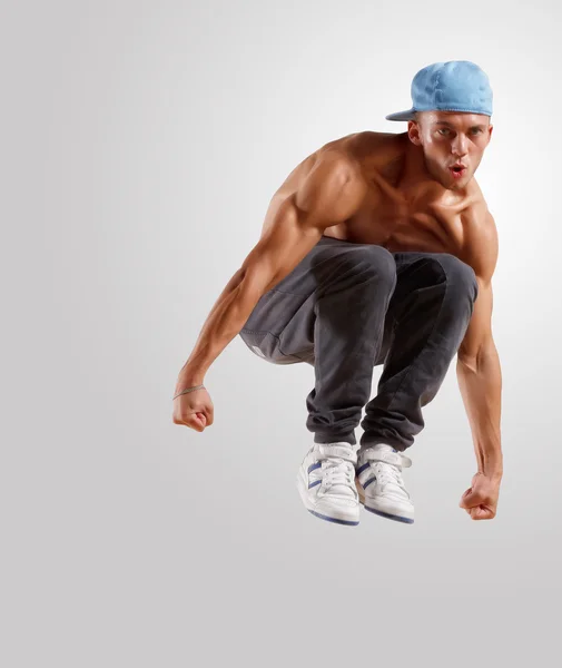 Young man in a blue cap dancing hip hop Stock Photo by ©SergeyNivens ...