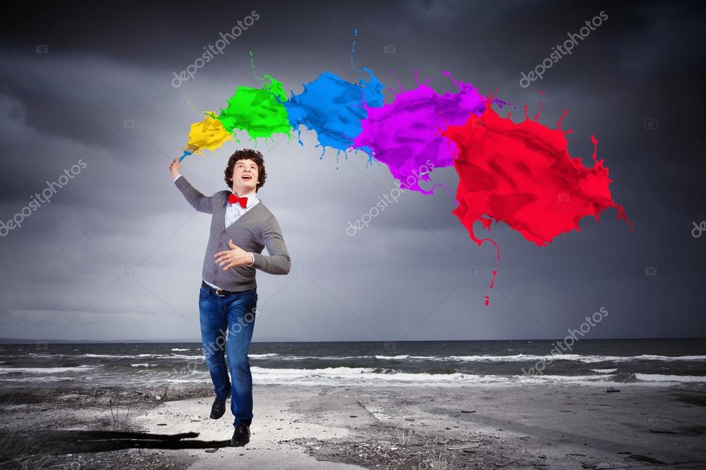 Young man and colour splash Stock Photo by ©SergeyNivens 29259741